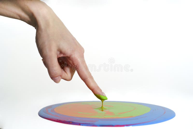 Human Hand with a Finger Touching a Circle of Colors and Mixing Them ...