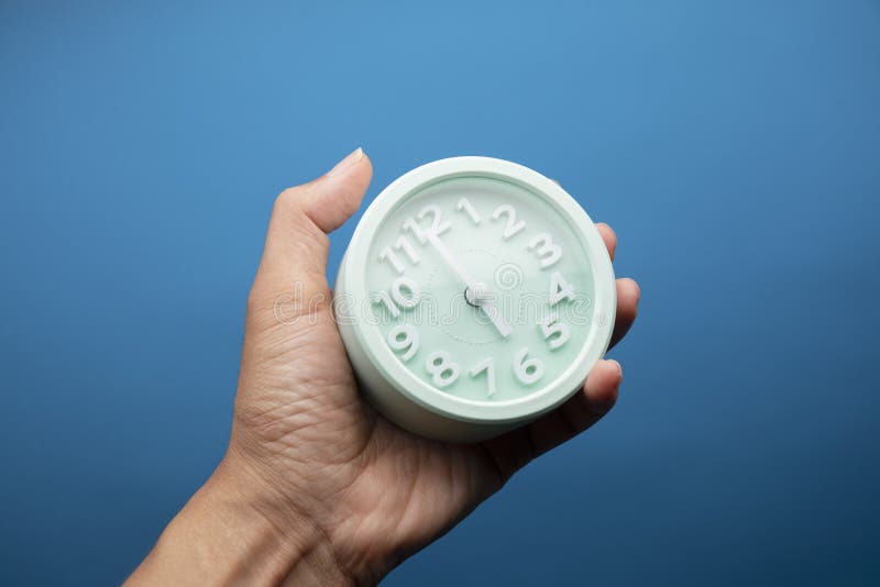 Human Hand Holding Alarm Clock Stock Photo - Image of limit, hour ...