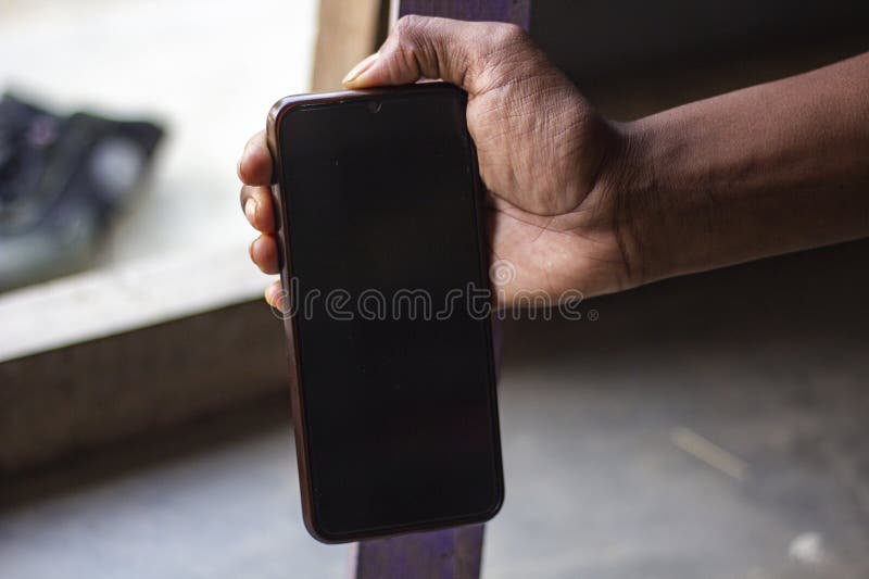 A Human Hand Holding a Black Screen Mobile Phone for Mock Up Stock ...