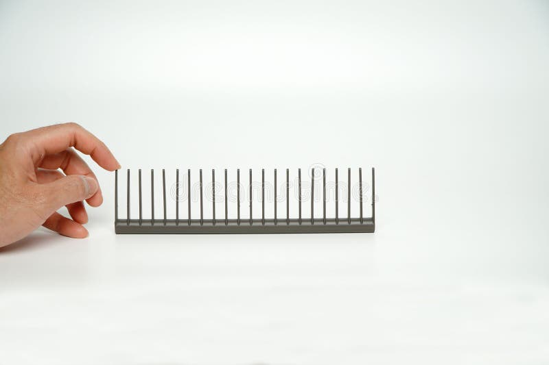 Human Hand Holding a Comb on White Background Isolation Stock Photo ...