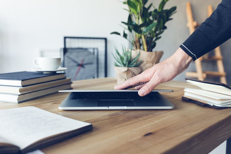 Human Hand Holding Laptop at Workplace Stock Image - Image of indoors ...