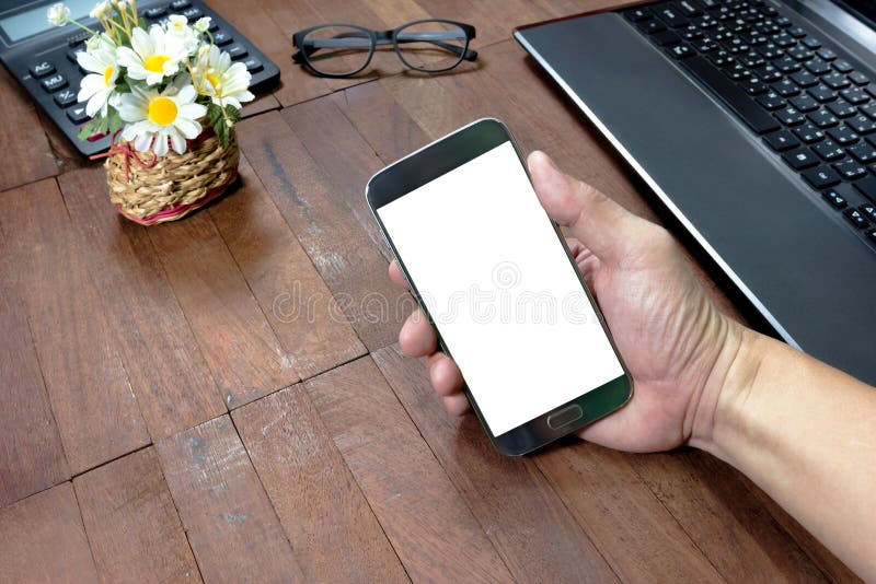 Human Hand Holding Mobile Smart Phone and Office Equipment on De Stock ...