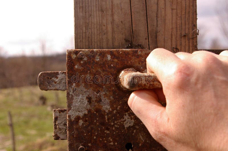 Human Hand Holding an Old Door Handle Covered with Rust. Rusty Vintage ...