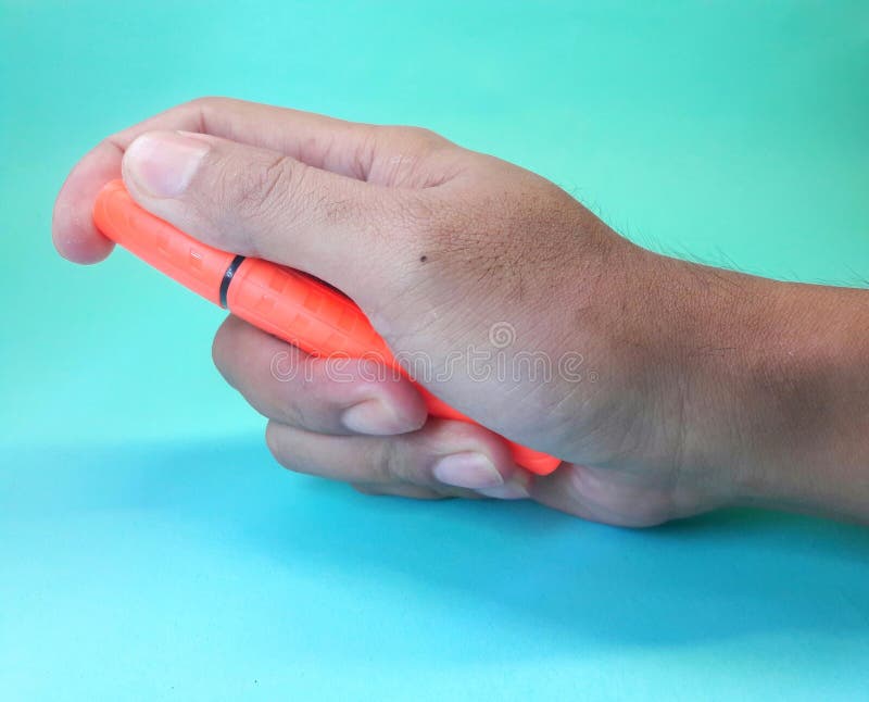 A Human Hand Holding an Orange Highlighter Stock Image - Image of hand ...