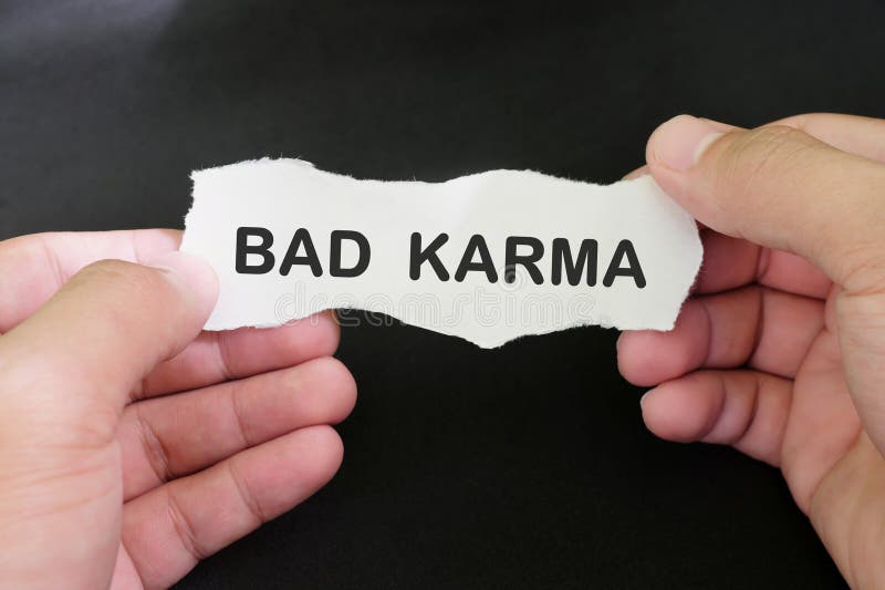 Human Hand Holding a Paper Note with Word Bad Karma in Dark Black ...