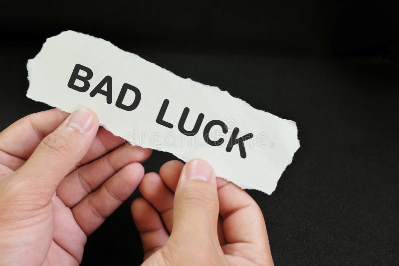 Human Hand Holding a Paper Note with Word Bad Luck in Dark Black ...