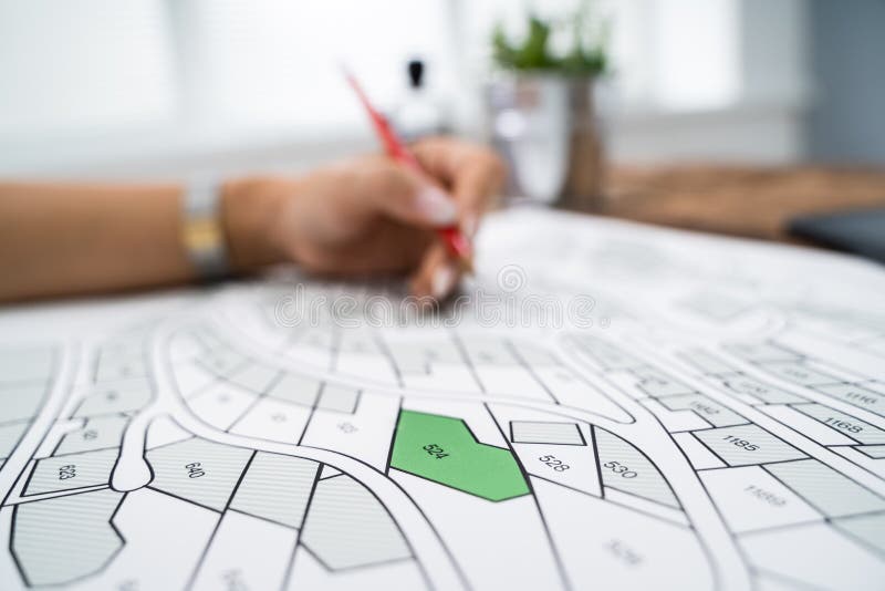 Human Hand Holding Pencil Over Cadastre Map Stock Image - Image of hand ...