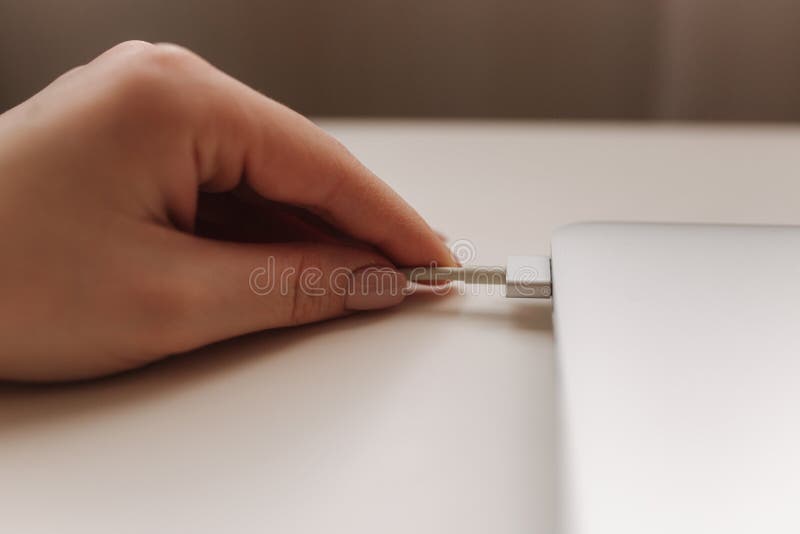 Human Hand Holding the Power Plug of Pc Notebook. Laptop Power Stock ...
