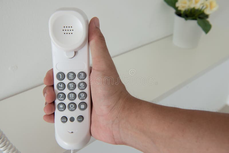 Human Hand is Holding the White Office Telephone Stock Photo - Image of ...