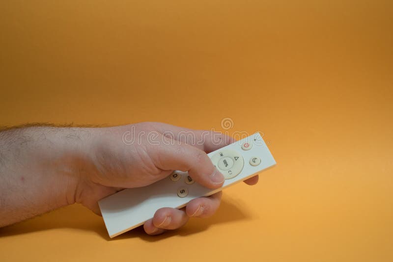 Human Hand Holding White Remote Control Adjusting the Electric Light ...