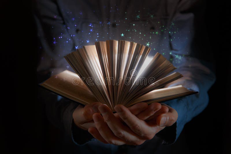 Hand Holding Open Book With Magic Lights Stock Image - Image of line ...