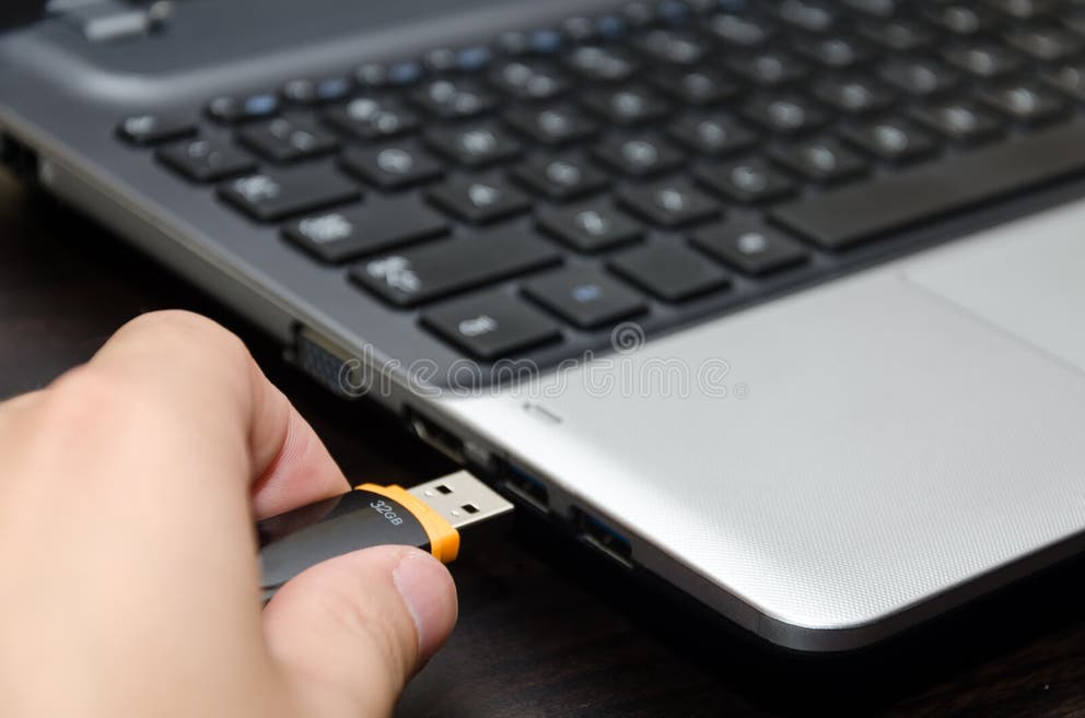Human Hand Inserting USB Flash Drive into Laptop Computer Close Up ...