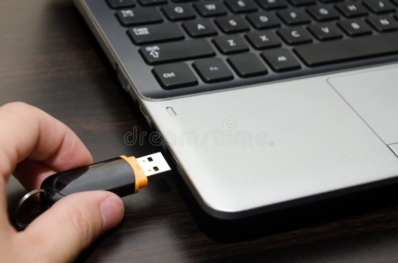 Human Hand Inserting USB Flash Drive into Laptop Computer Close Up ...