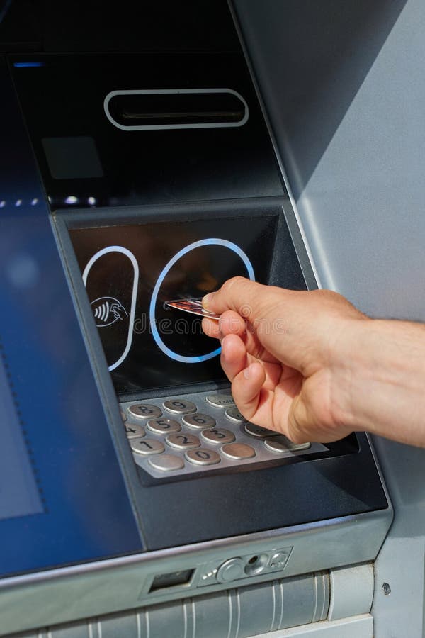 Human Hand Inserts a Plastic Card into an ATM Editorial Photography ...