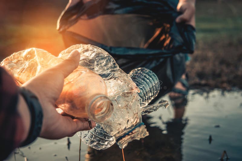 Hand Keeping Plastic Bottle and Garbage in the Nature Stock Photo ...