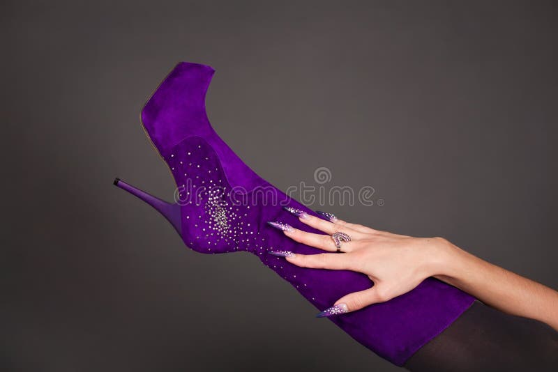 Human Hand with Manicure Touch Purple Boot Stock Image - Image of hands ...