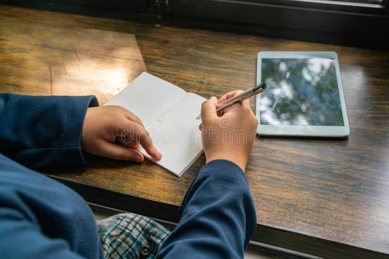 Human Hand with Pen and Writing into Note Stock Image - Image of table ...