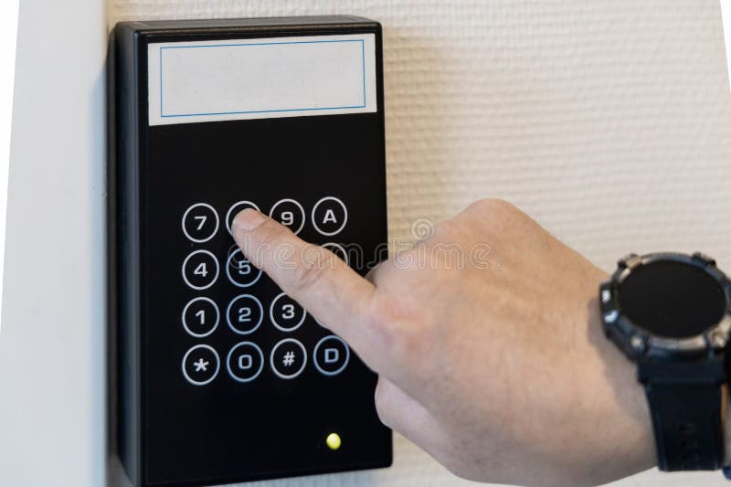 A Human Hand Presses Buttons with Numbers To Enter a Code To Open the ...