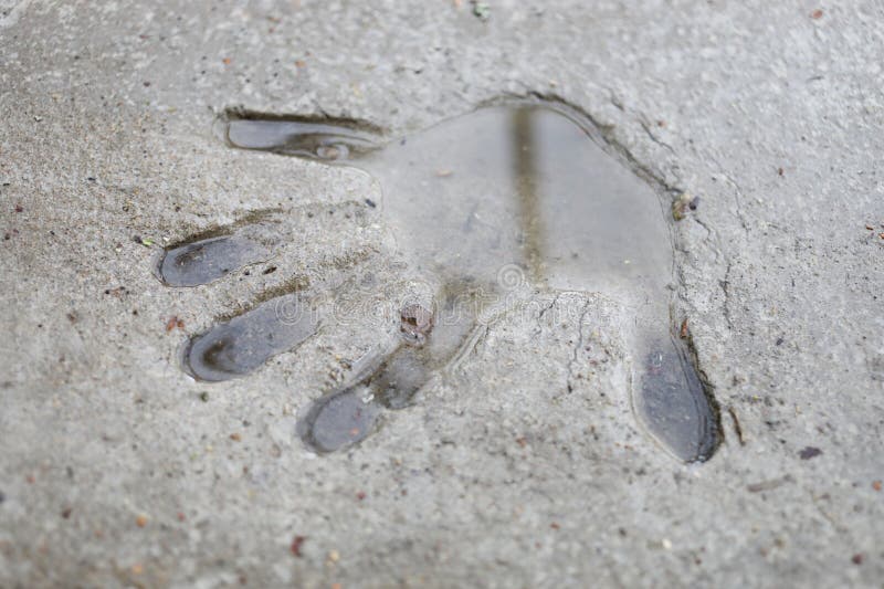Human Hand Print on Grey Concrete Slab with Water Stock Photo - Image ...