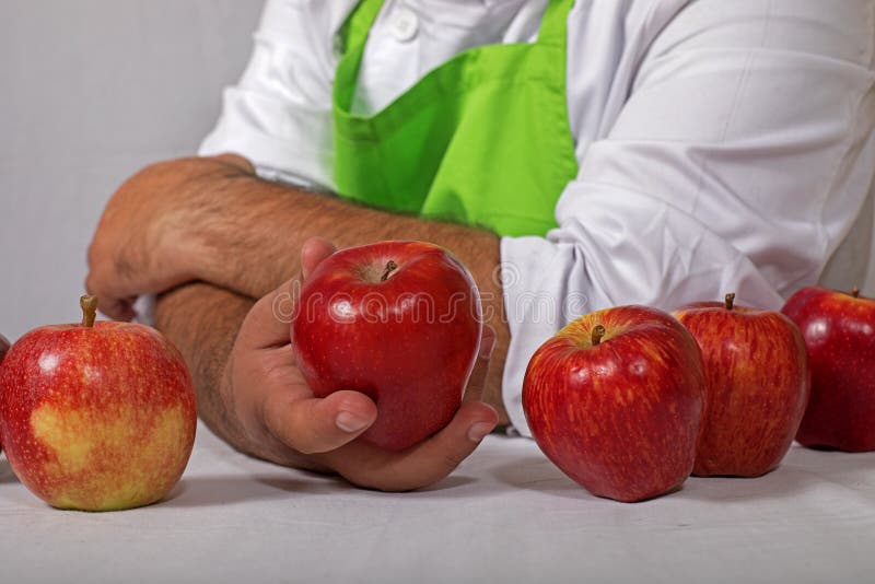 Human with red apples stock image. Image of clothes, farming - 99398433