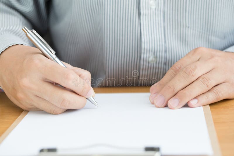 Human Hand Signing White Paper on Wood Table Stock Image - Image of ...
