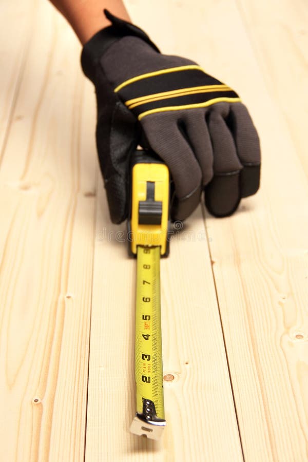Human Hand Taking Measurement on a Block of Wood Stock Image - Image of ...