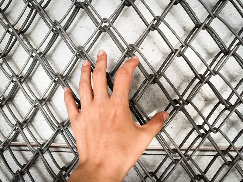 Human Hand Touch on Old and Rust Chain Link Mesh,sign and Symbol for ... Human Hand Touch on Old and Rust Chain Link Mesh,sign and Symbol for ...