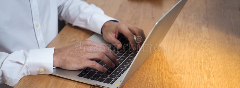 The Human Hand Uses the Keyboard by the Notebook on the Desk. Internet ...