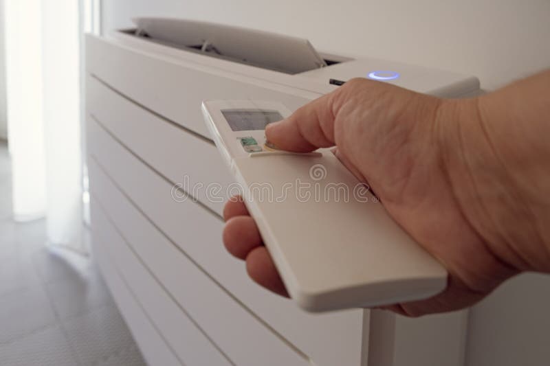 Uses TV Remote Controller. Two Female Twins Lying on the White Bed at ...