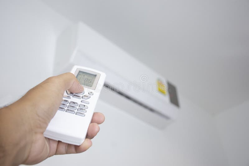Human Hand is Using White Remote of Air Conditioner Stock Image - Image ...