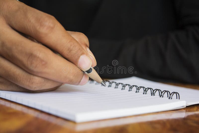 Human hand writing a note stock image. Image of college - 119137497