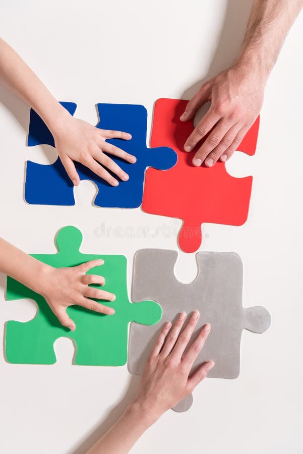 Human Hands on Colorful Puzzle Pieces Stock Photo - Image of pieces ...