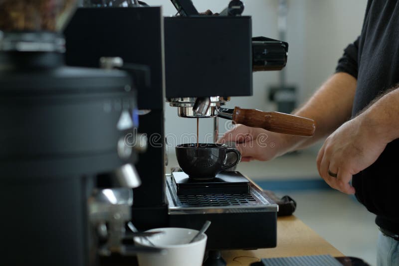 Human Hands Holding a Cup Under Coffee Under the Machine Stock Image ...
