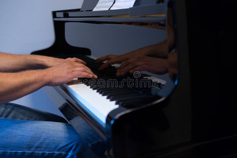 Human Hands Playing the Keys Notes and Chords on a Classic Black Piano ...