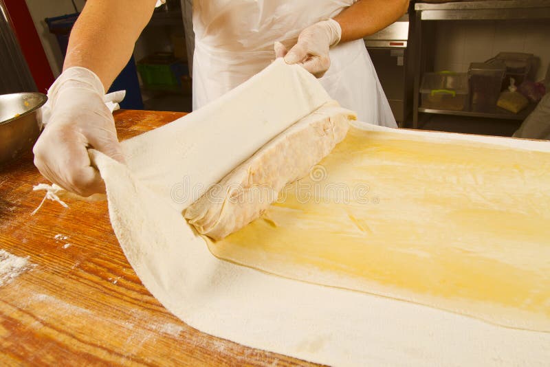 Human Hands Roll Strudel into a Roll Using a Towel Stock Image - Image ...