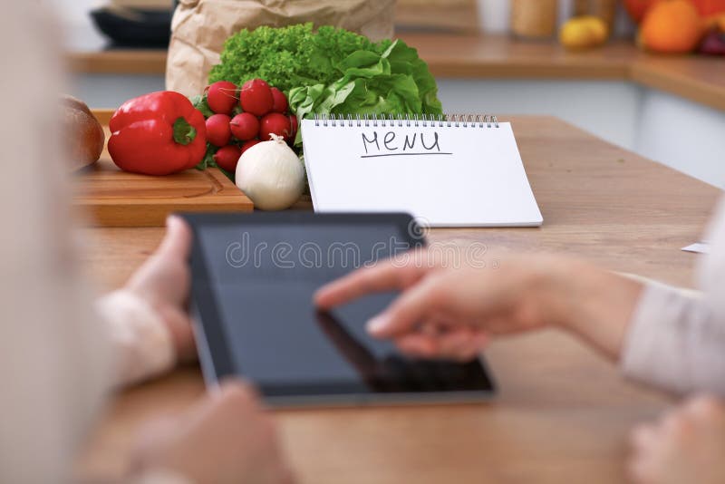 Human Hands Pointing into Touch Pad with Copy Space Area. Two Woman ...