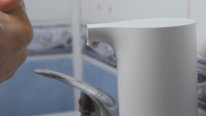 Human Hands Use Automatic Dispenser with Liquid Soap and Wash Under ...