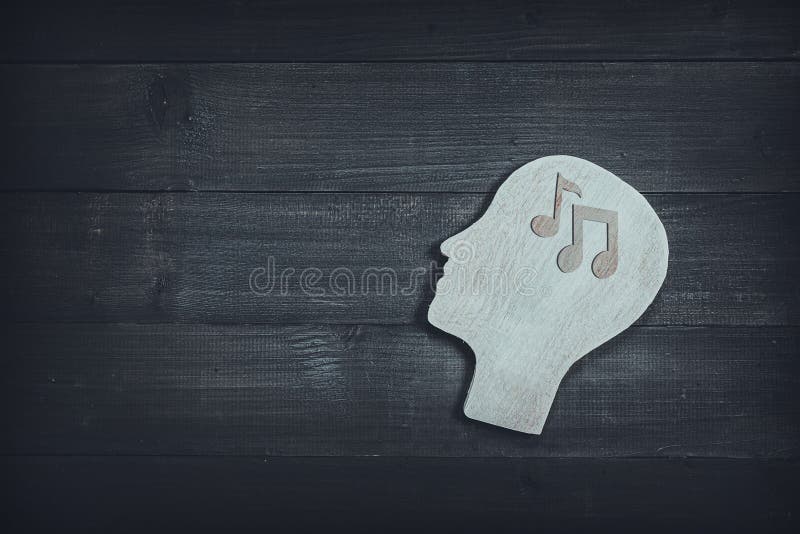 Human Head and Face with Music Note Sign on Wood Table Background ...