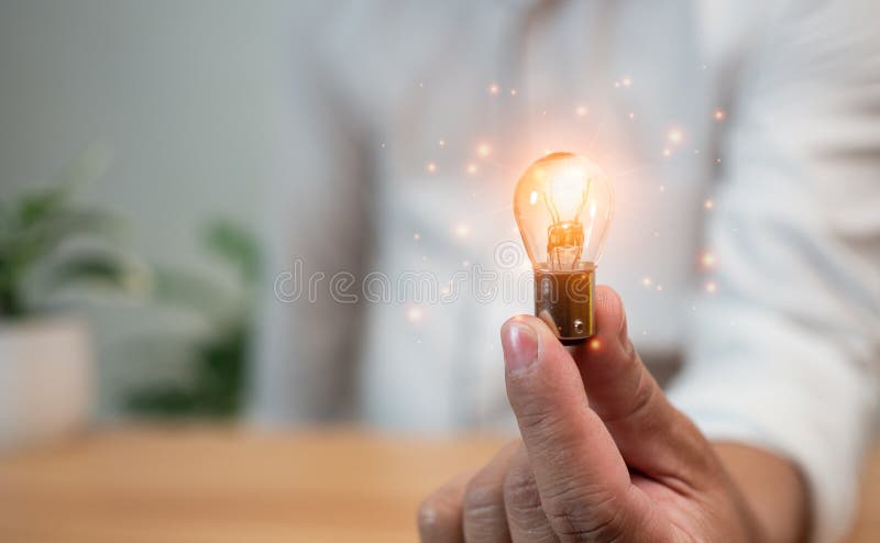 Human is Holding a Light Bulb. it Represents the Concept of Education ...