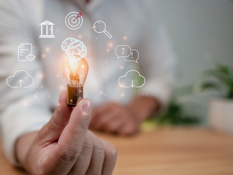 Human is Holding a Light Bulb. it Represents the Concept of Education ...