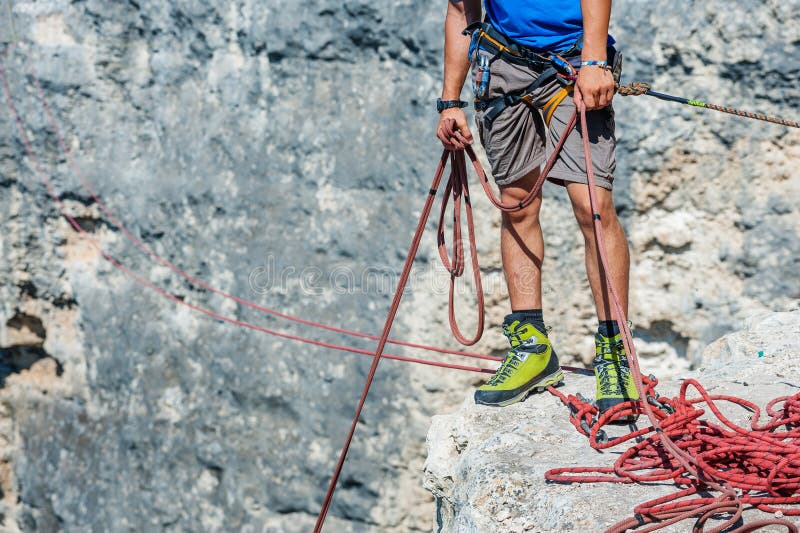 Human Legs on Cliff with Rope. Stock Image - Image of jump, lead: 76024385