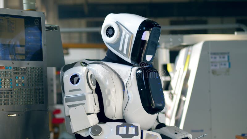 Human Factory Worker and a Robot are Walking Together in Factory ...
