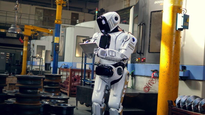 Human Factory Worker and a Robot are Walking Together in Factory ...