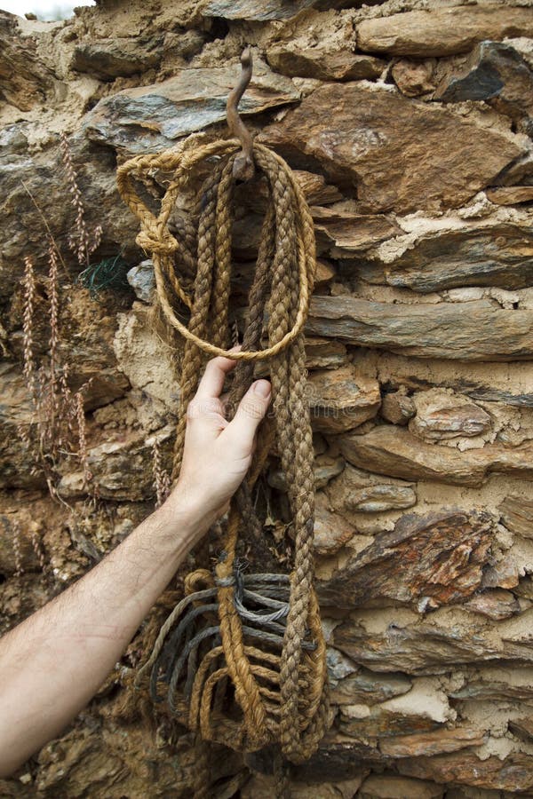 Rope in a wall stock photo. Image of brown, ropes, stone - 101228190