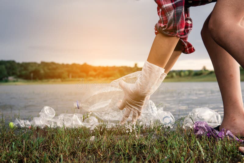 Human Picking Up a Bottle Plastic in the River Stock Photo - Image of ...
