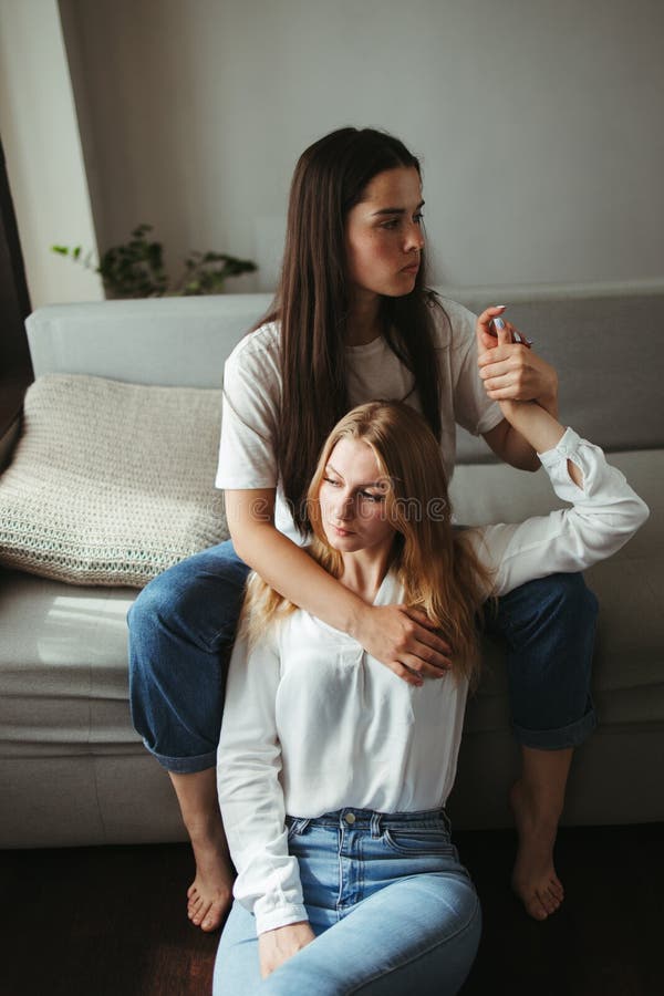 Two Young Women Cuddling in Living Room Stock Photo - Image of people ... Two Young Women Cuddling in Living Room Stock Photo - Image of people ...