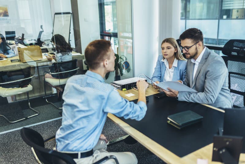 Human Resource Team Talking To a Candidate during a Job Interview in ...
