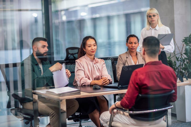 Human Resource Team Talking To a Candidate during a Job Interview in ...