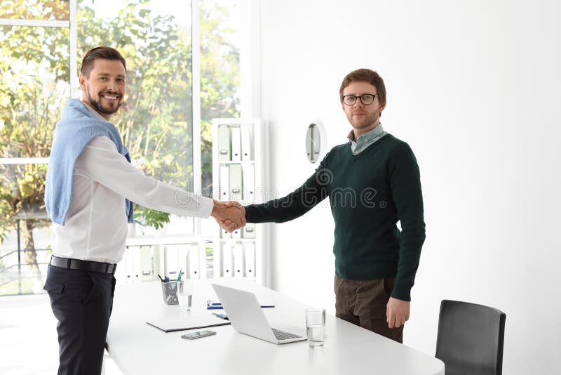 Human Resources Manager Shaking Hands with Applicant during Job ...