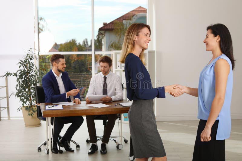 Human Resources Manager Shaking Hands with Applicant during Job ...